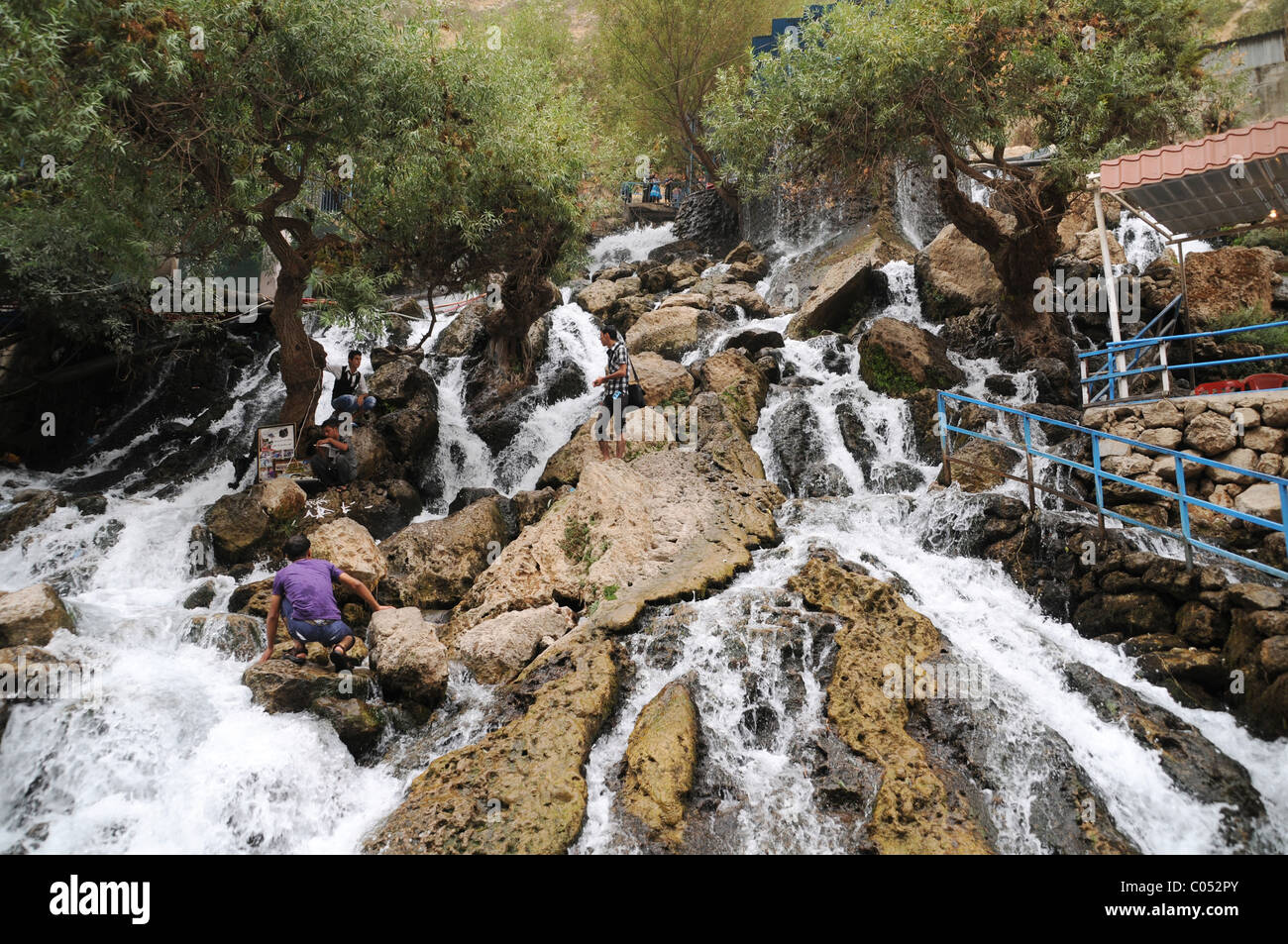 Kurdish tourists visiting the Bekhal waterfall in Zagros Mountains of ...