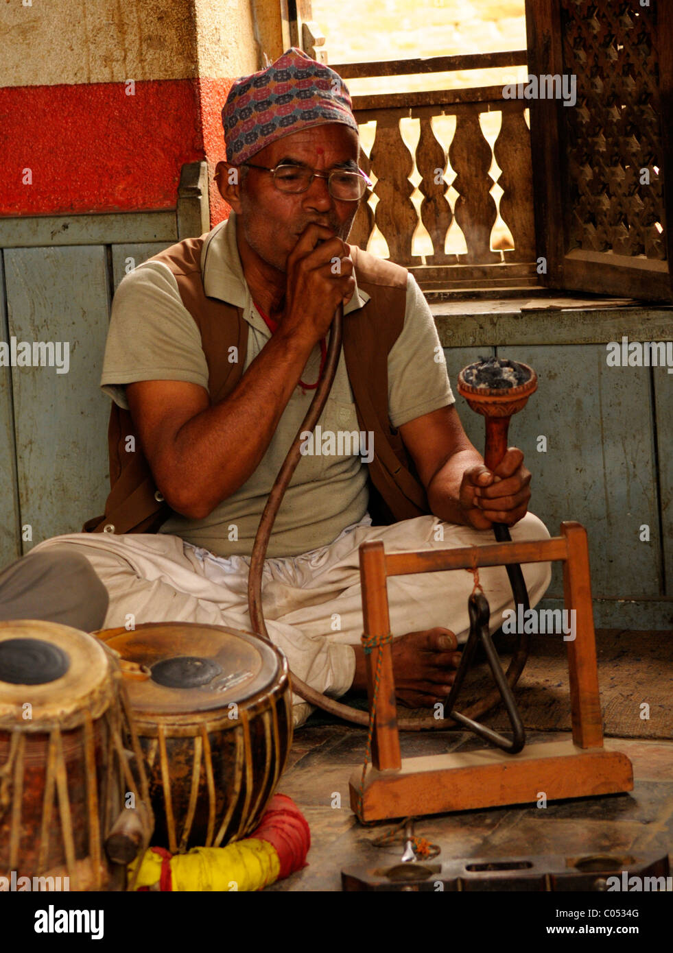 nepalese man smoking sheesha pipe , peoples lives ( the nepalis ...
