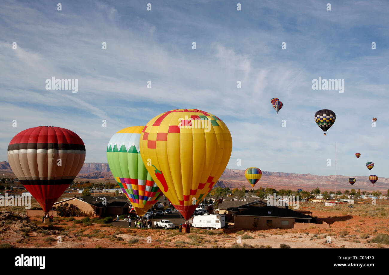 Hot air balloons fly over the desert of Page, Arizona near Lake Powell ...