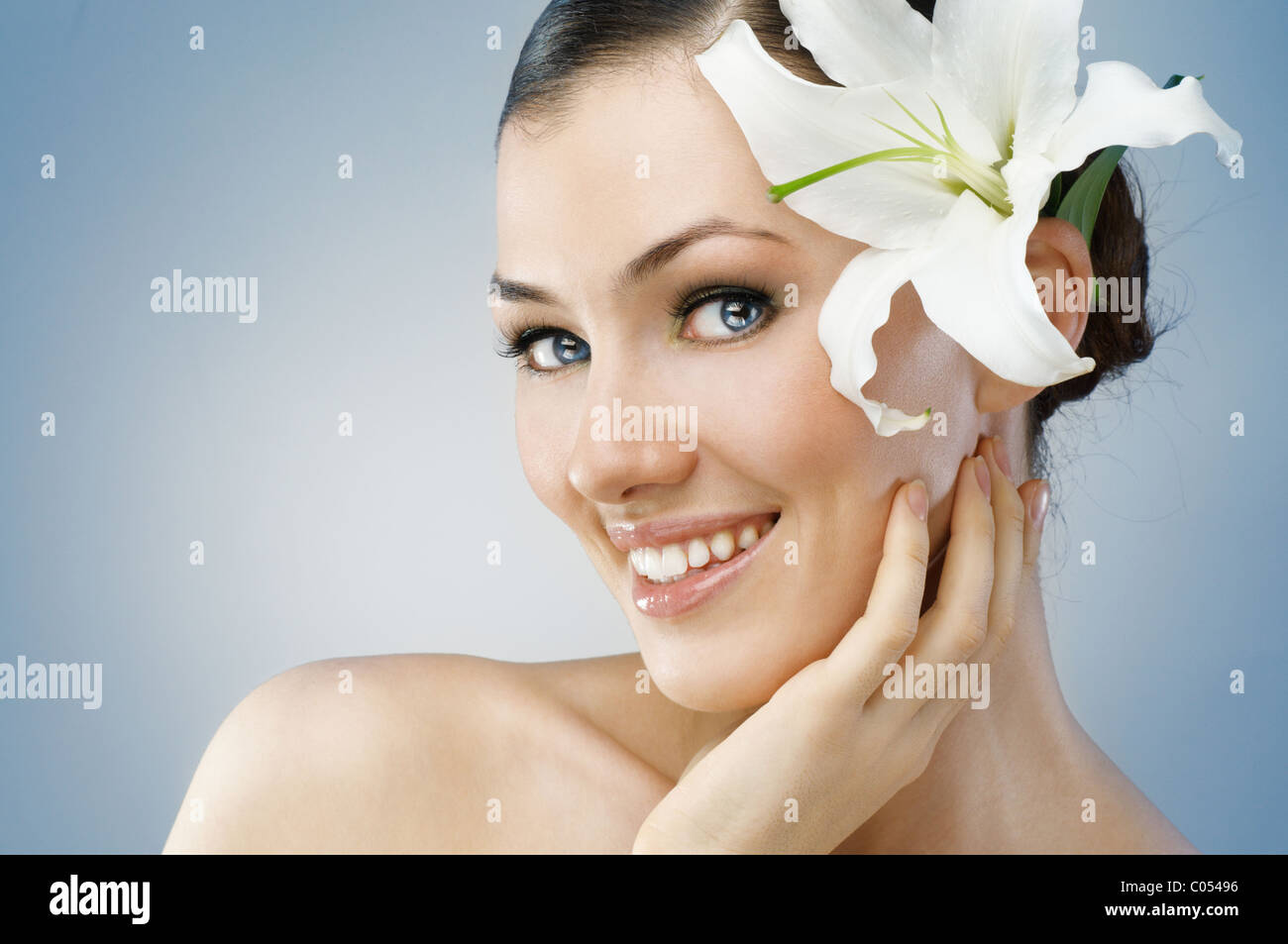 beauty flower girl on the blue background Stock Photo - Alamy