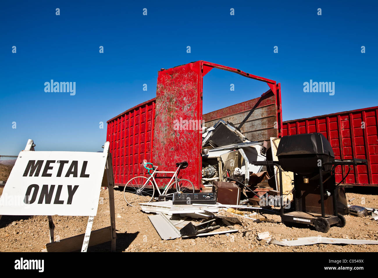 Worn out, discarded items in a scrap metal recycling dumpster Stock ...