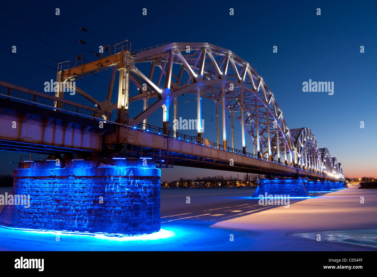 Railway bridge at night in winter close up Stock Photo - Alamy