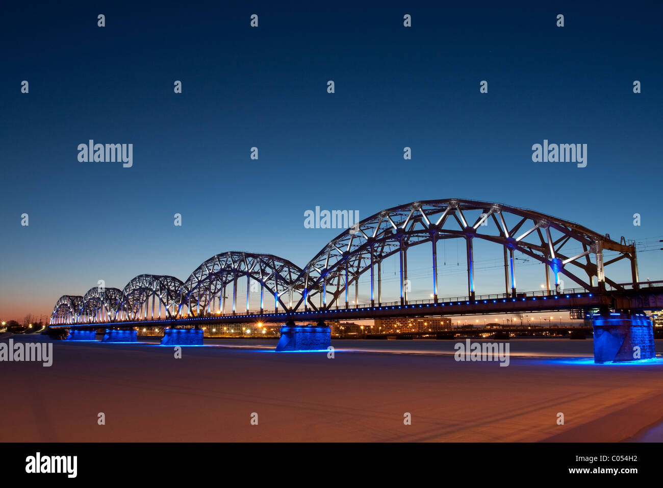 Railway bridge at night in winter close up Stock Photo - Alamy