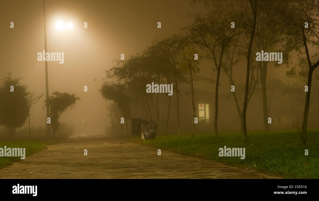 Foggy whether at night small house Stock Photo - Alamy