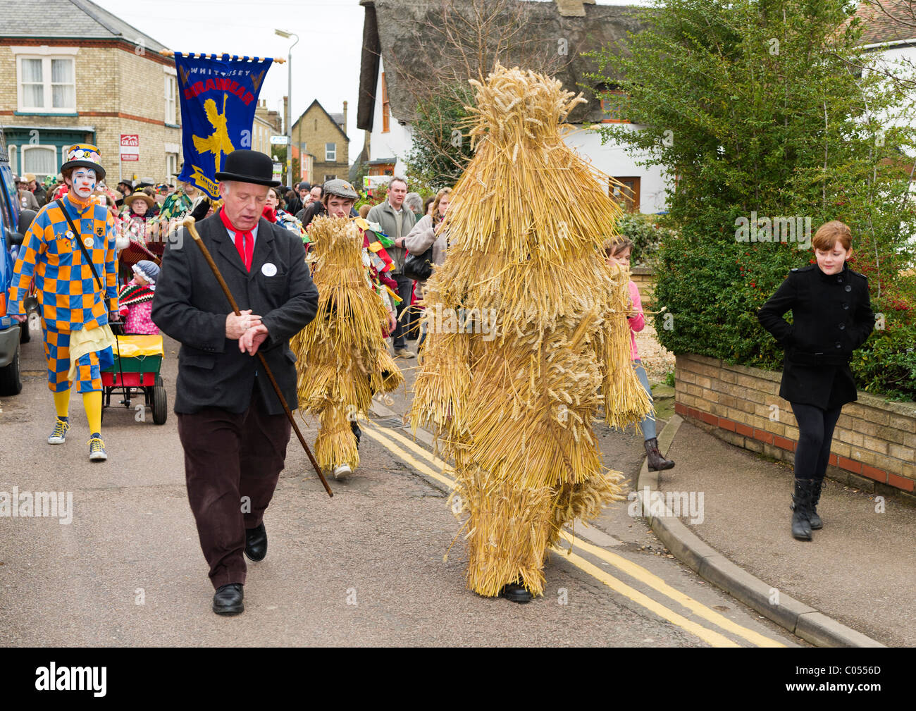 Whittlesea Straw Bear and keeper lead the parade at the Whittlesea ...