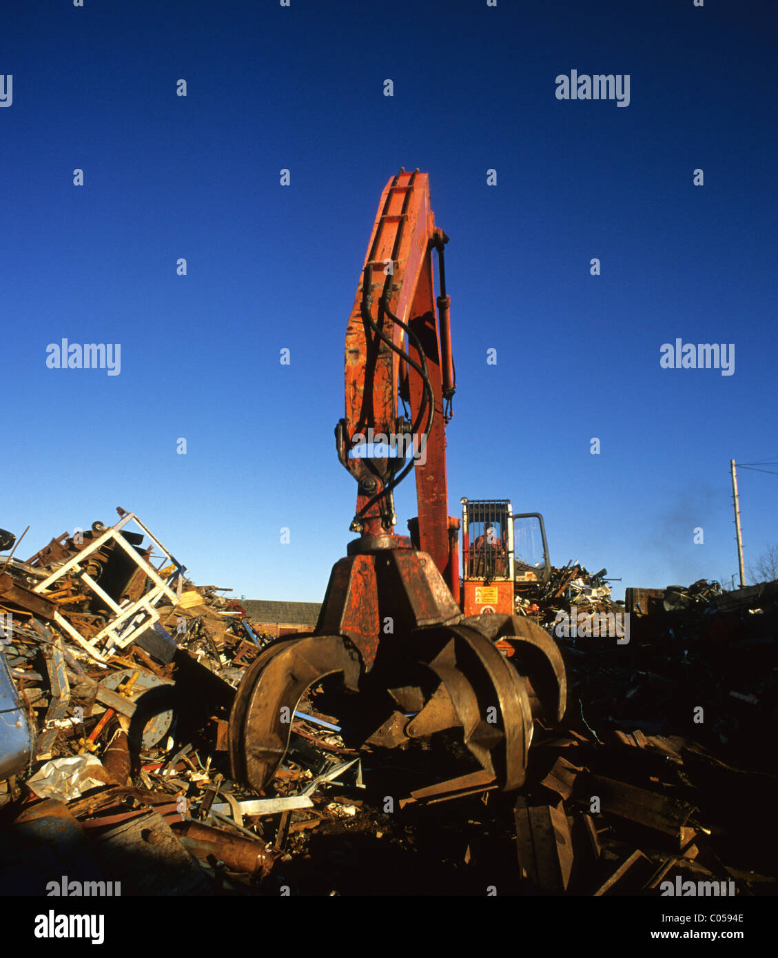 hydraulic grab on crane lifting load of scrap metal for recycling at ...