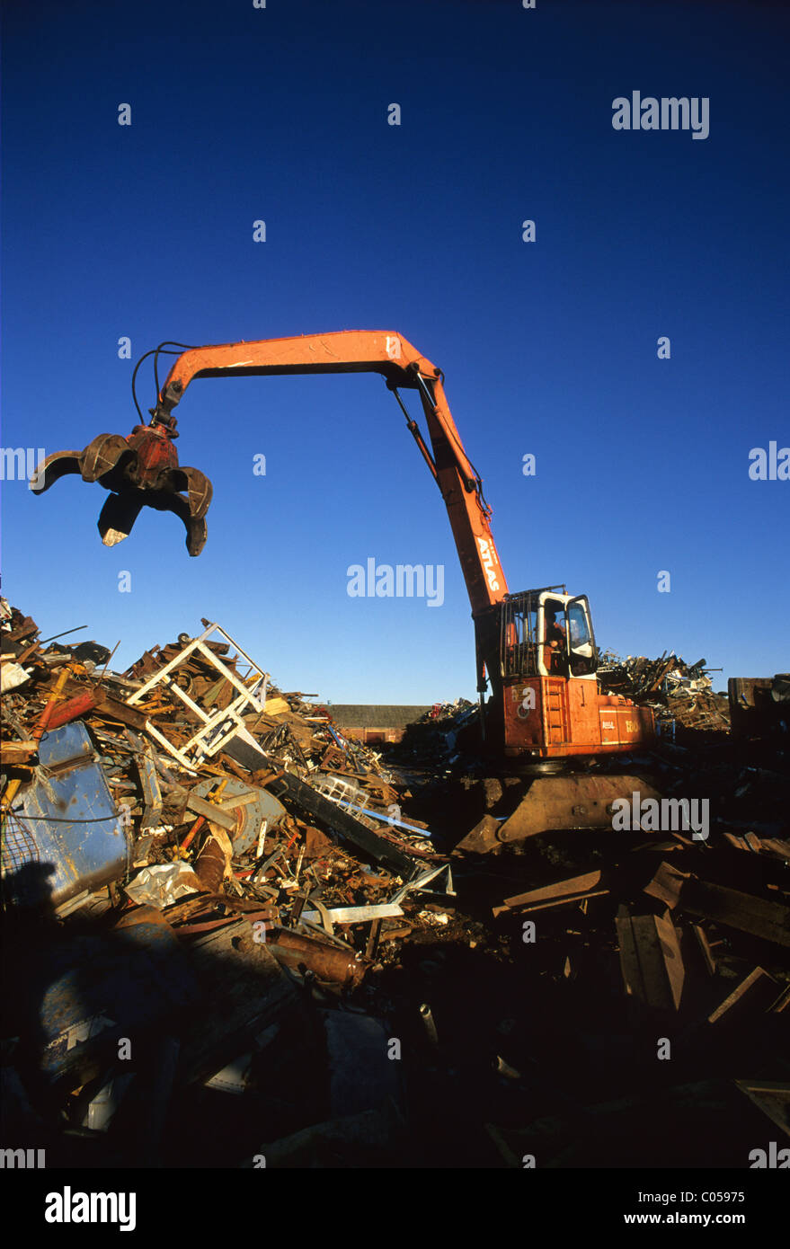 hydraulic grab on crane lifting load of scrap metal for recycling at ...