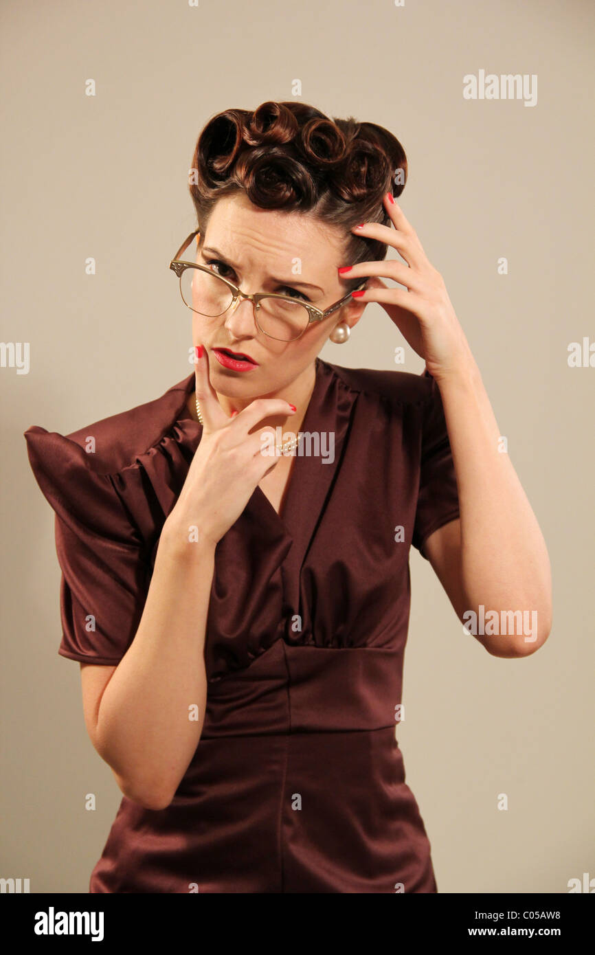 Old fashioned lady looking puzzled Stock Photo - Alamy