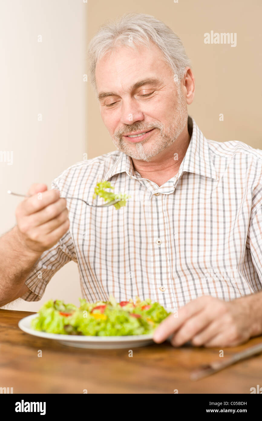 Old man eating dinner alone hi-res stock photography and images - Alamy