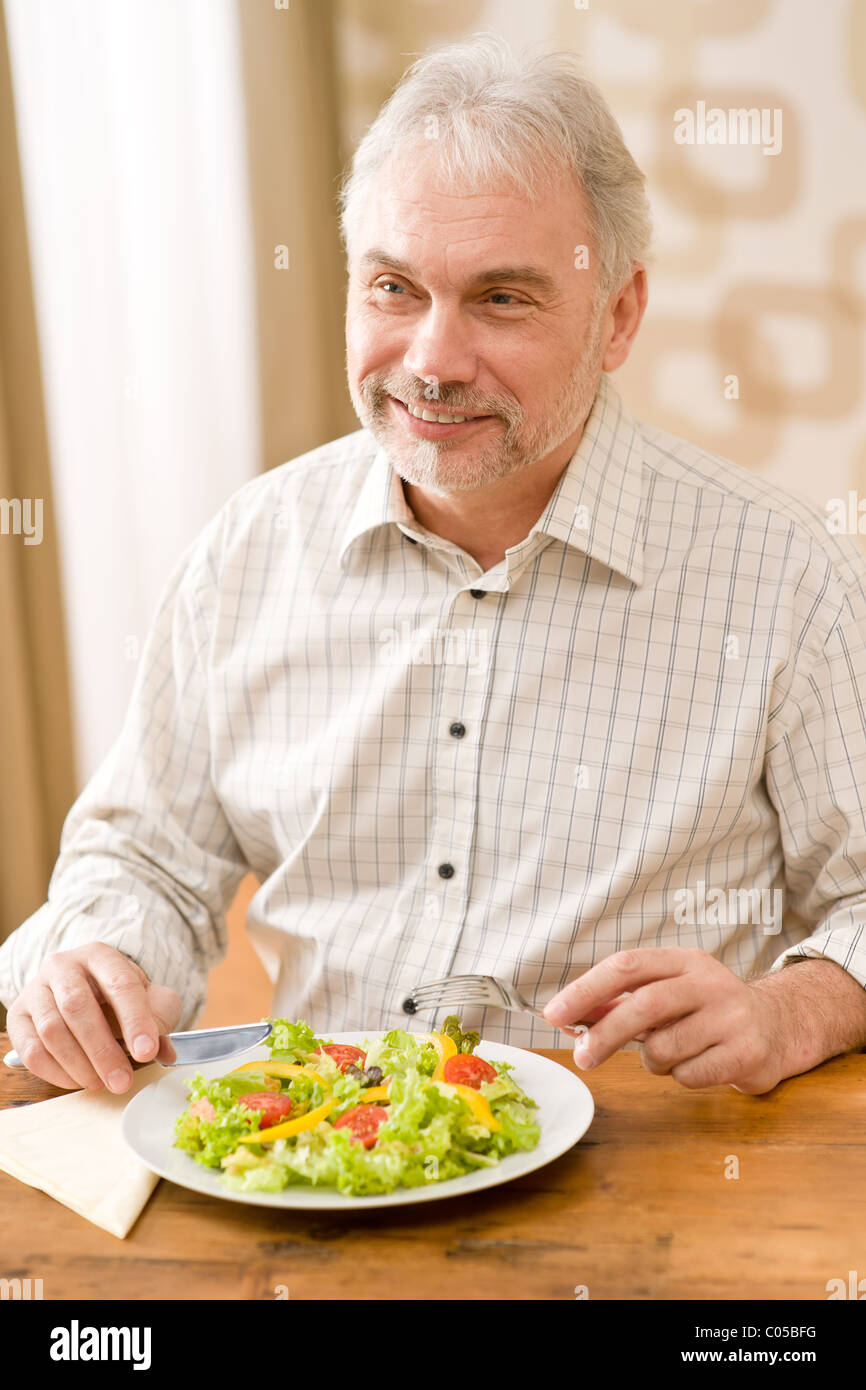 Old man eating dinner alone home hi-res stock photography and images ...