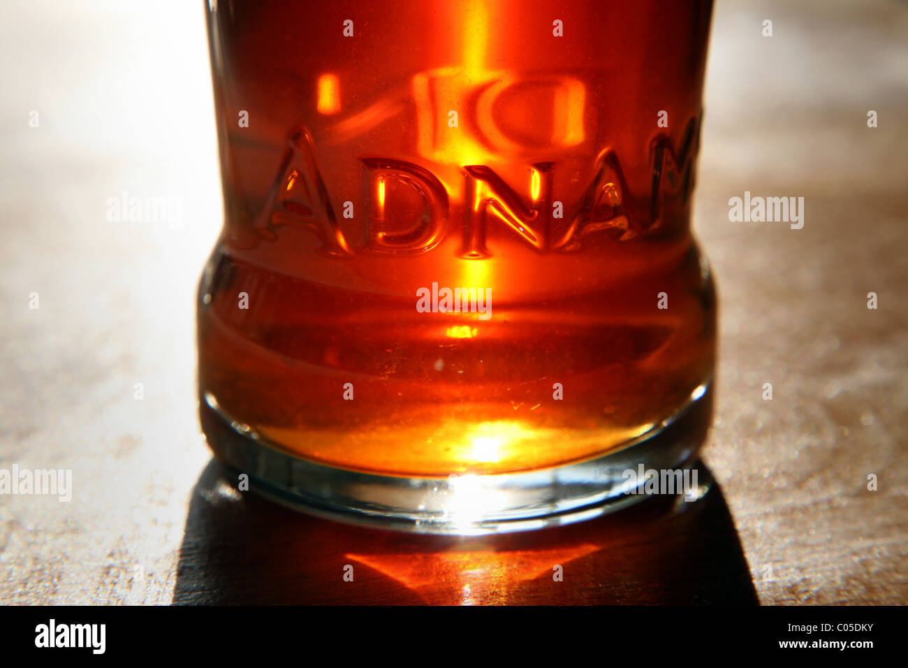 A pint of Adnams beer in an Adnams glass Stock Photo - Alamy