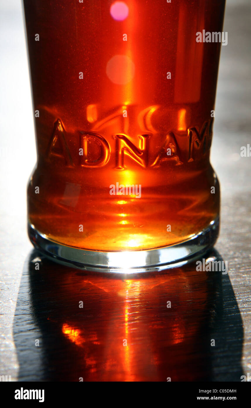 A pint of Adnams beer in an Adnams glass Stock Photo - Alamy