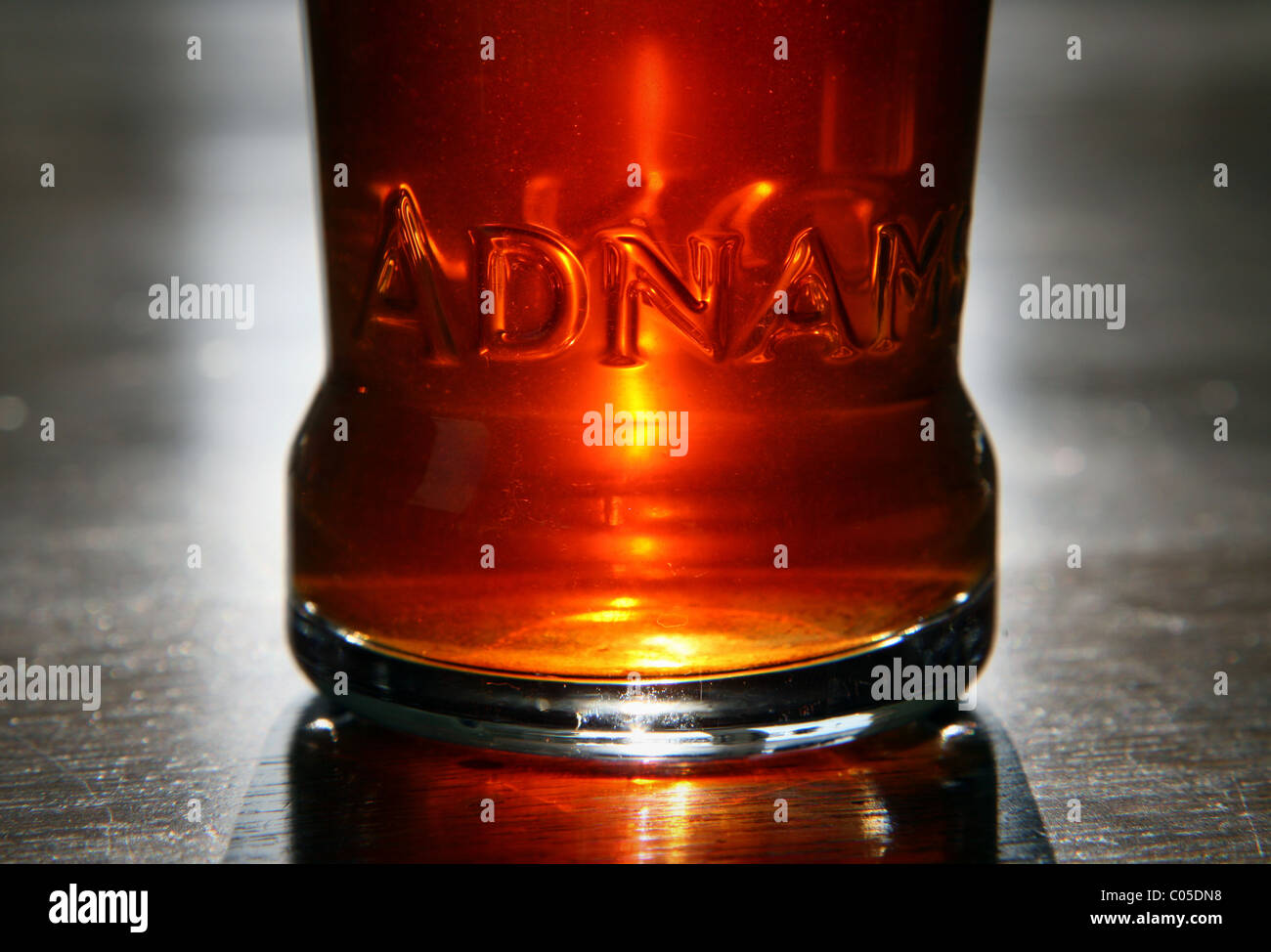 A pint of Adnams beer in an Adnams glass Stock Photo - Alamy