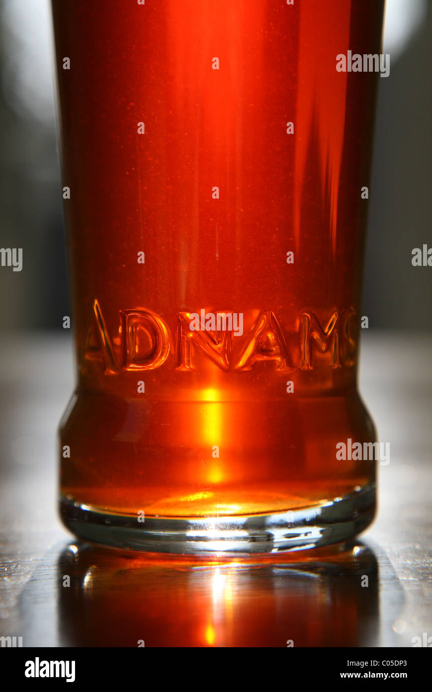 A pint of Adnams beer in an Adnams glass Stock Photo - Alamy