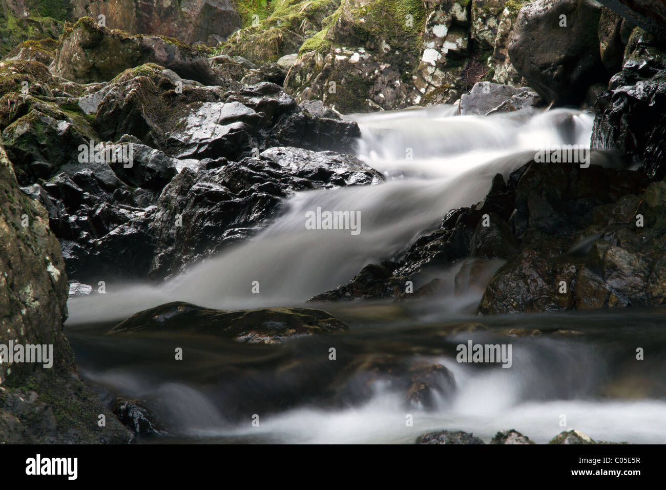 Small waterfall under a bridge beside Thirlmere reservoir Stock Photo ...