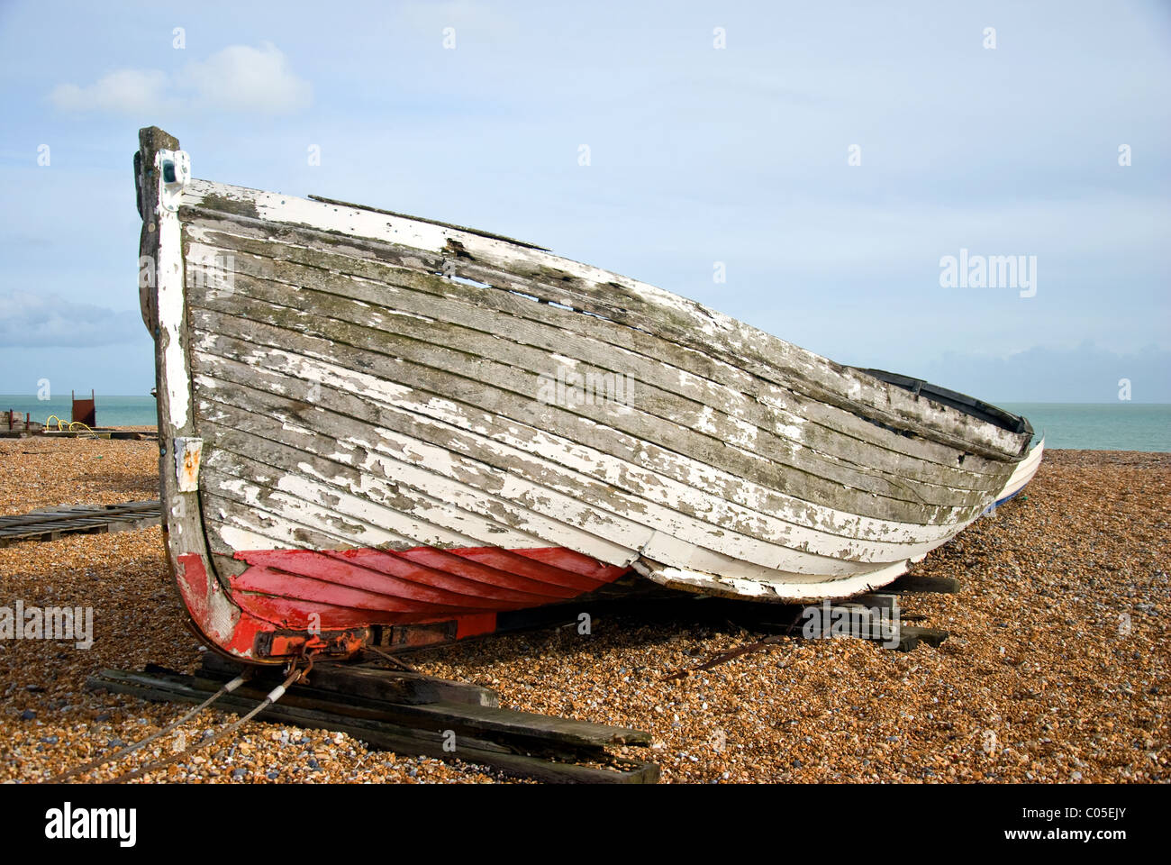 Old wooden boat on a beach Stock Photo - Alamy