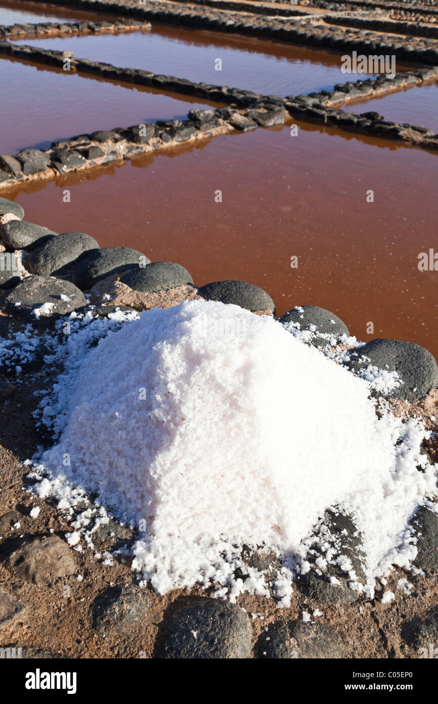 A pile of sun dried salt beside the evaporation pans at the ...