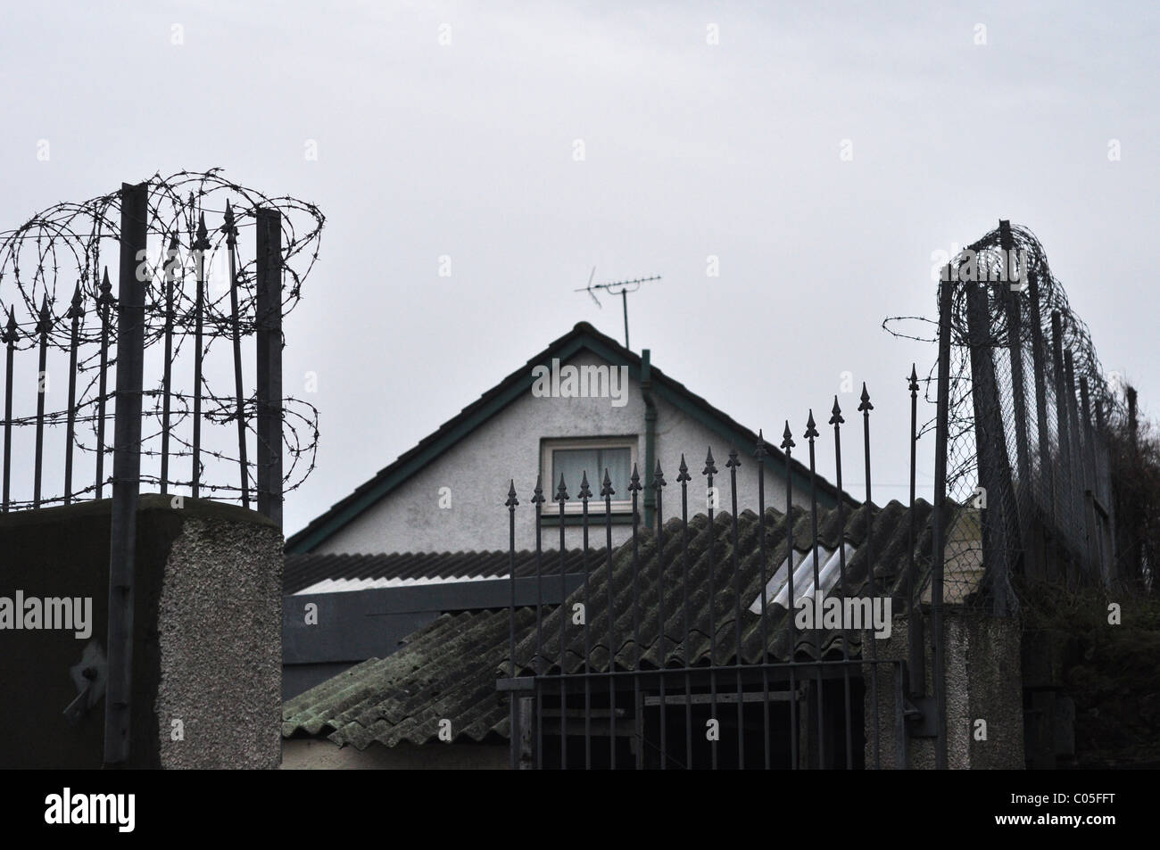 barbed wire house Stock Photo - Alamy