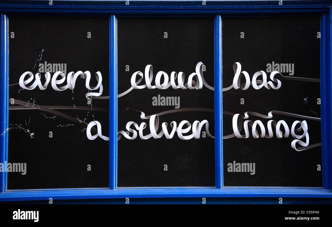 Every Cloud has a Silver Lining Message in Shop Window Stock Photo - Alamy