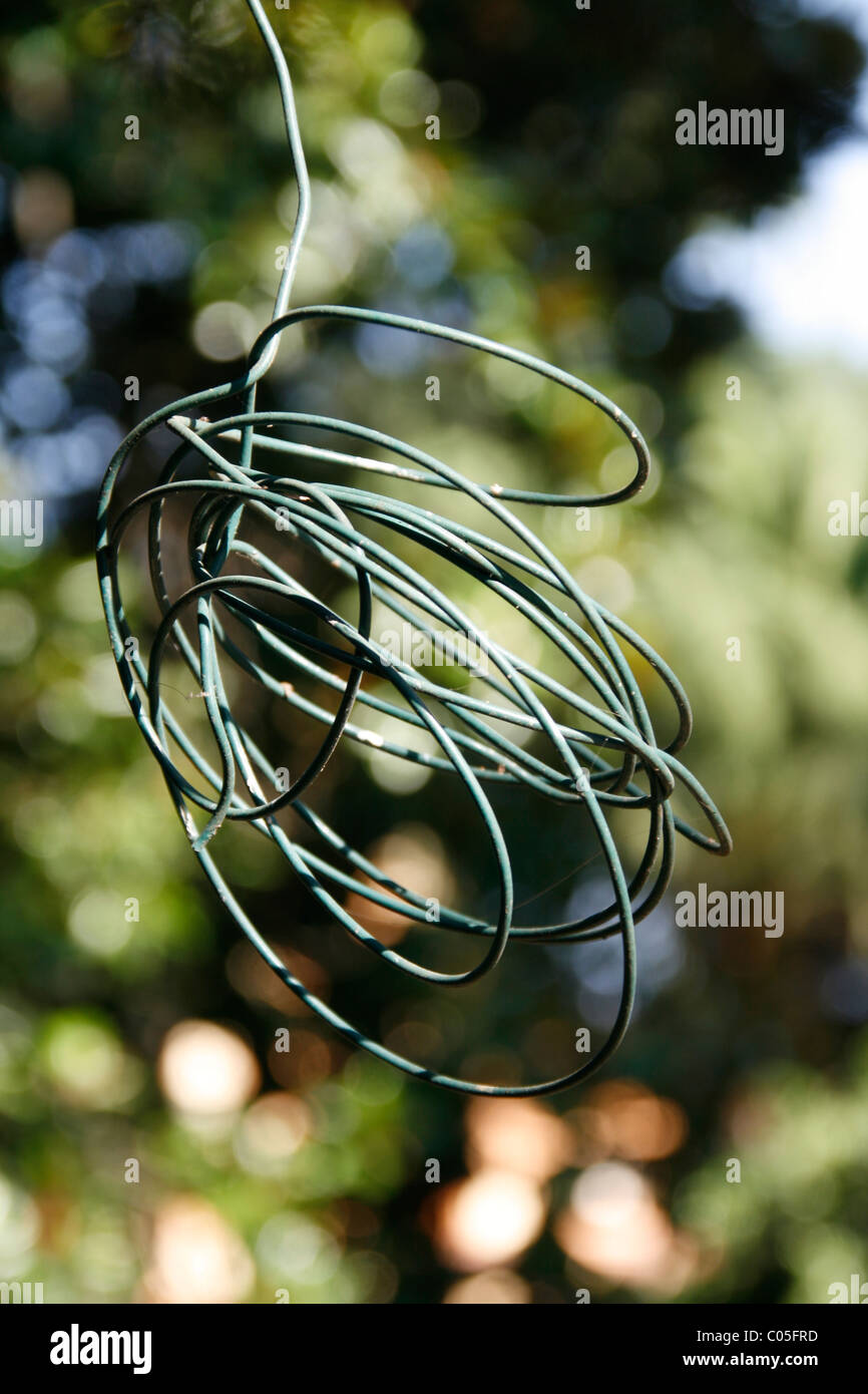 coil of metal wire hanging outdoors Stock Photo - Alamy