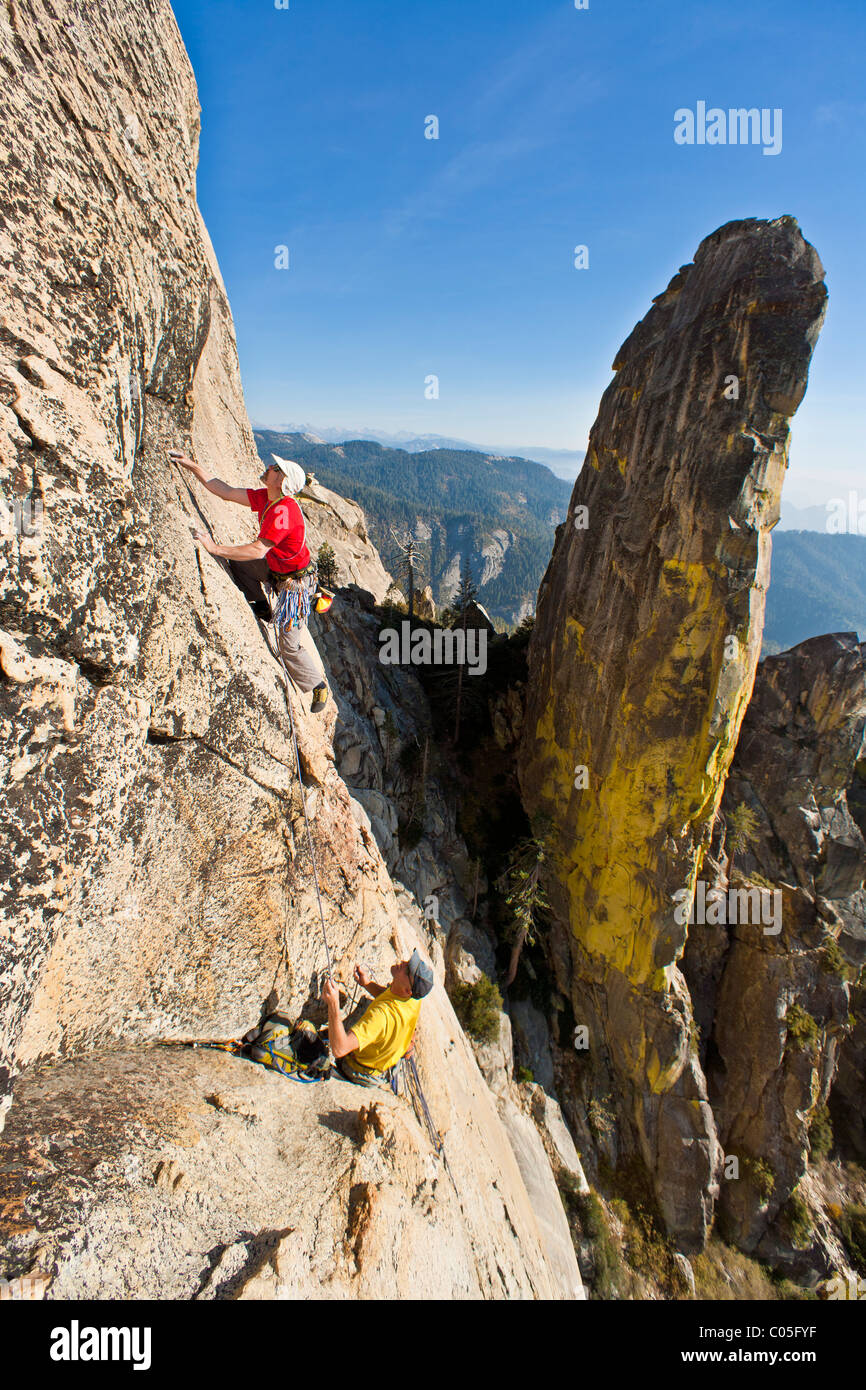 Team of climbers on the summit Stock Photo - Alamy