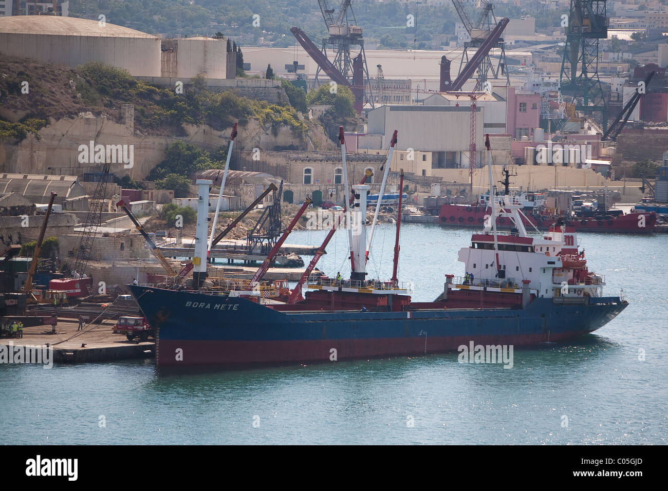 Cargo ship delivering steel shipment. Valletta harbour Malta Stock ...