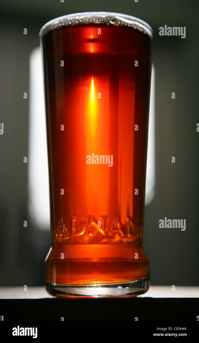 A pint of Adnams beer in an Adnams glass Stock Photo - Alamy
