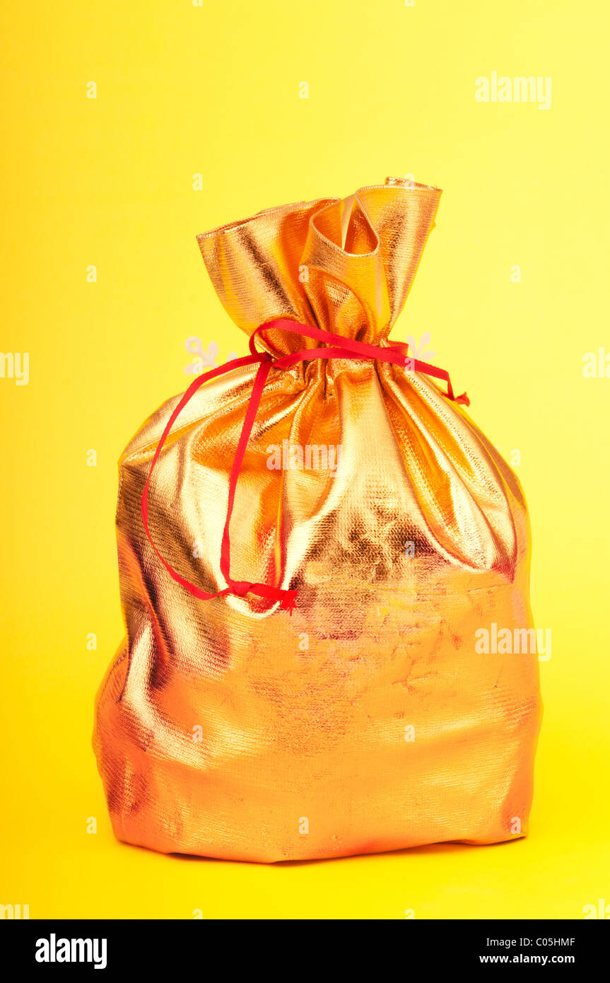 Golden sacks full of something good Stock Photo - Alamy
