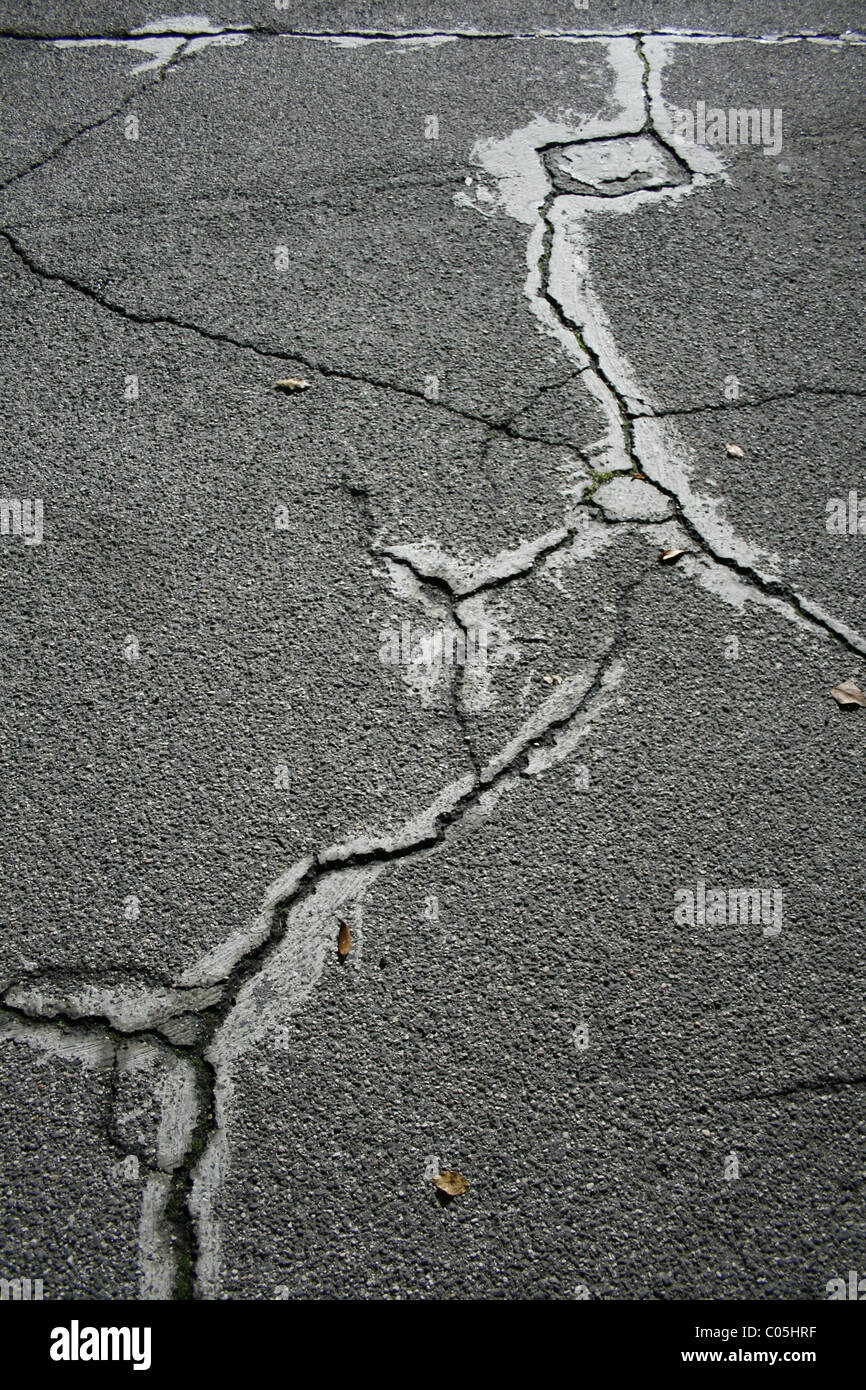 damaged street surface at night in city town Stock Photo - Alamy