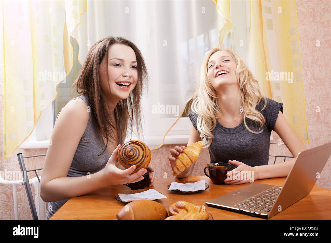 two girls drinking tea Stock Photo - Alamy