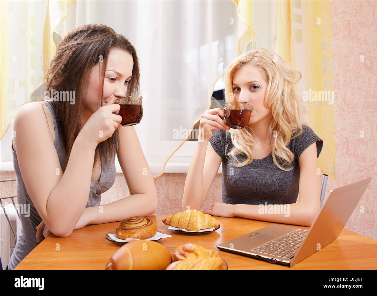 two girls drinking tea Stock Photo - Alamy