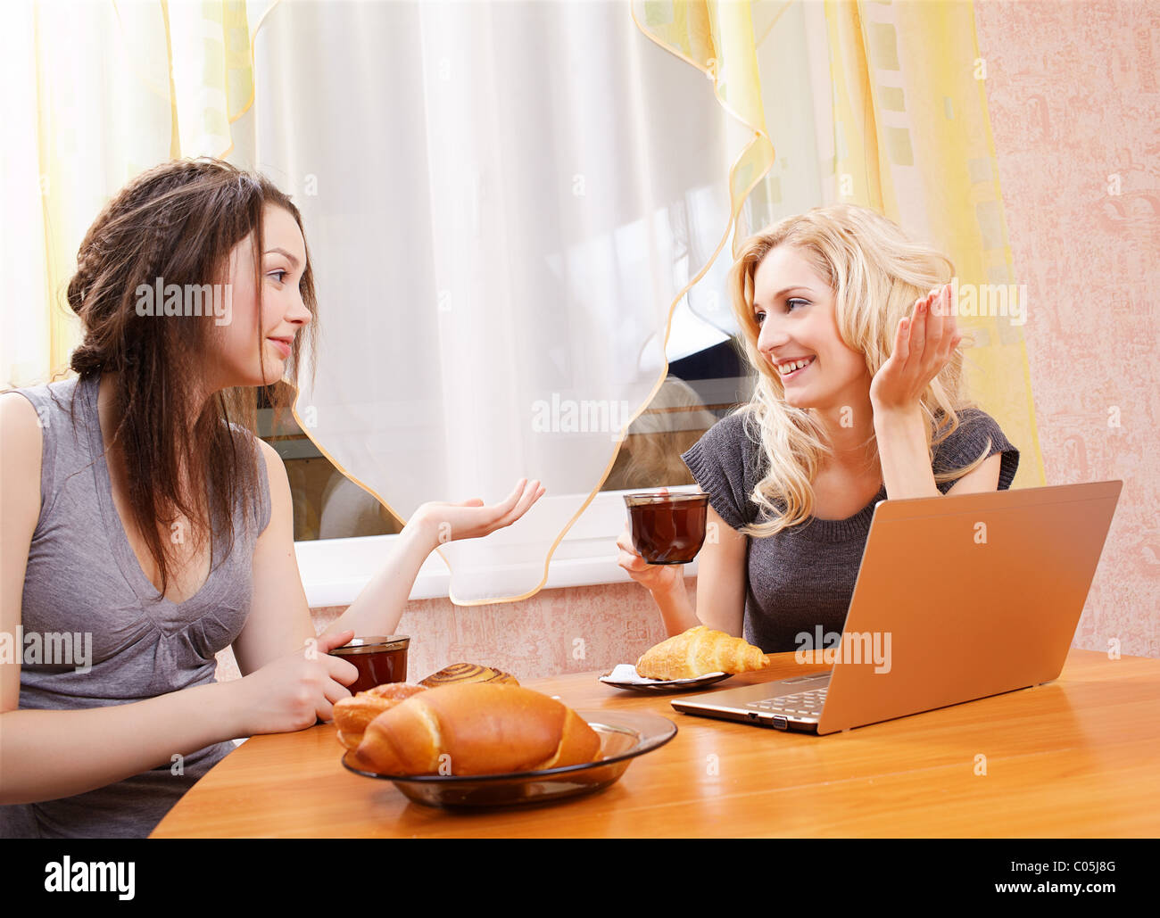 two girls drinking tea Stock Photo - Alamy