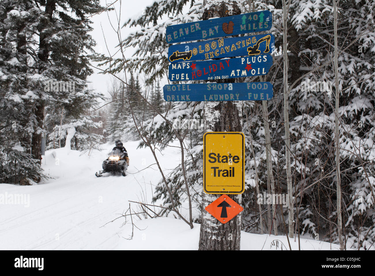 Passing snowmobile and state trail sign on the Superior Hiking Trail in ...