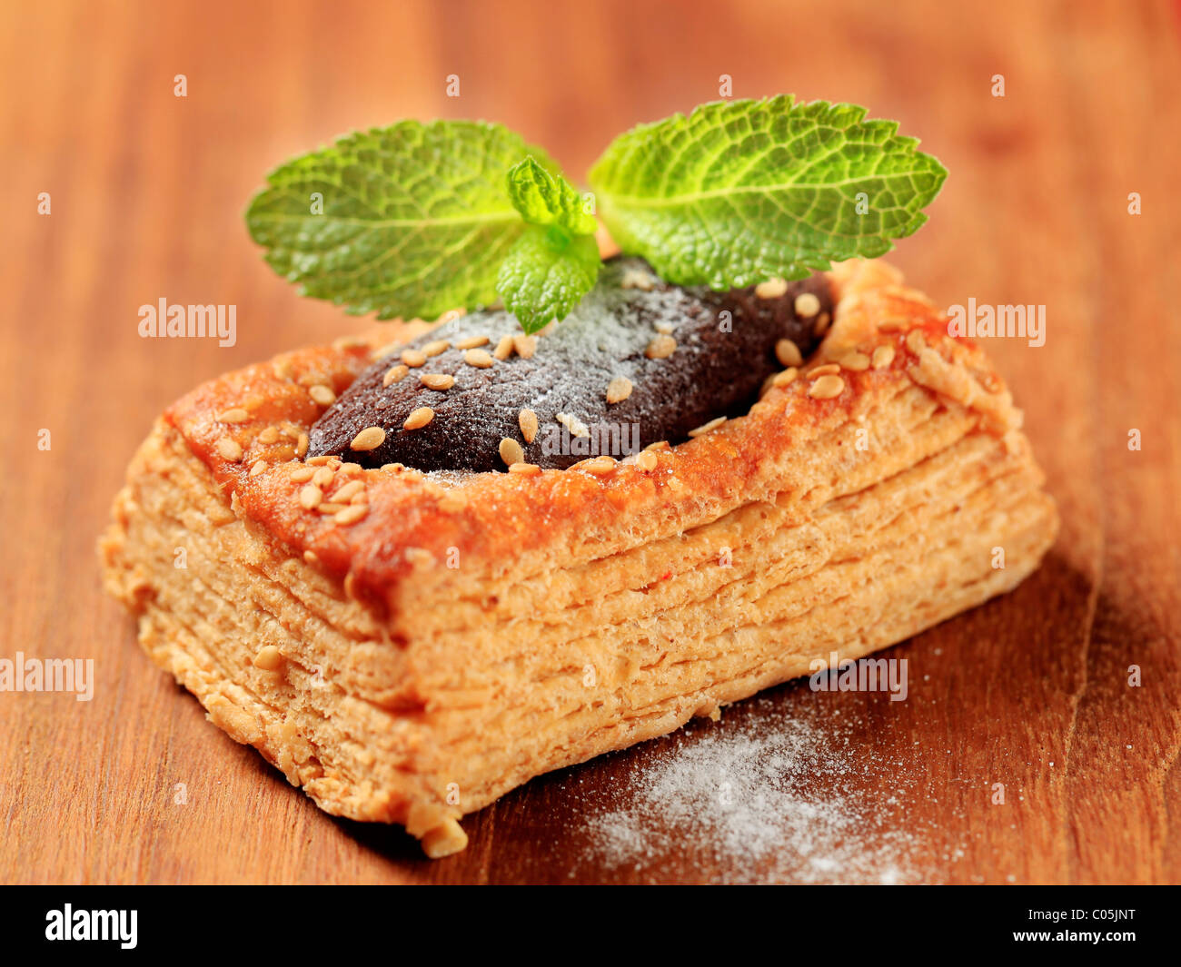 Puff pastry with chocolate filling sprinkled with sesame seeds Stock ...