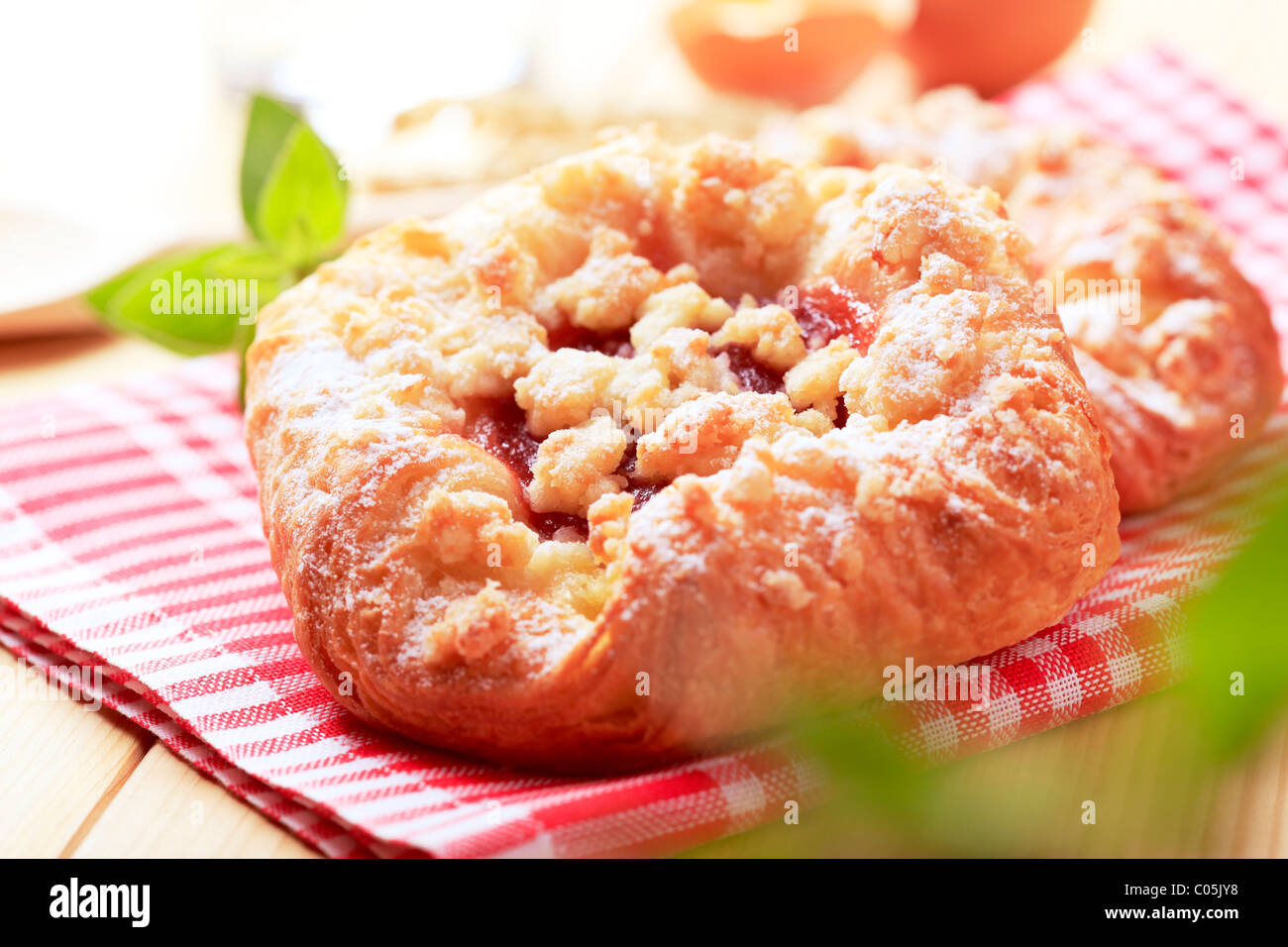 Danish pastry with jam and crumb topping Stock Photo - Alamy