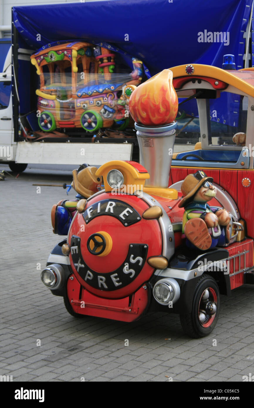 child fairground ride train on a transport truck lorry Stock Photo - Alamy