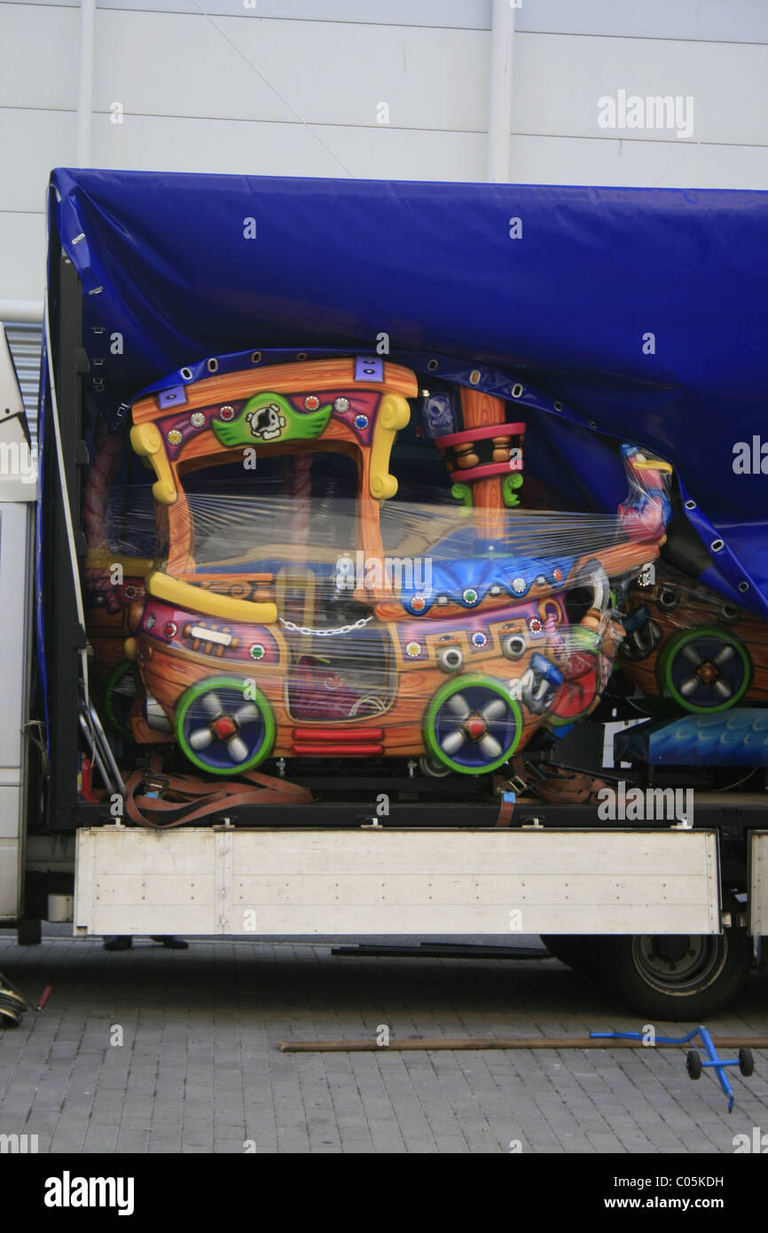 child fairground ride train on a transport truck lorry Stock Photo - Alamy
