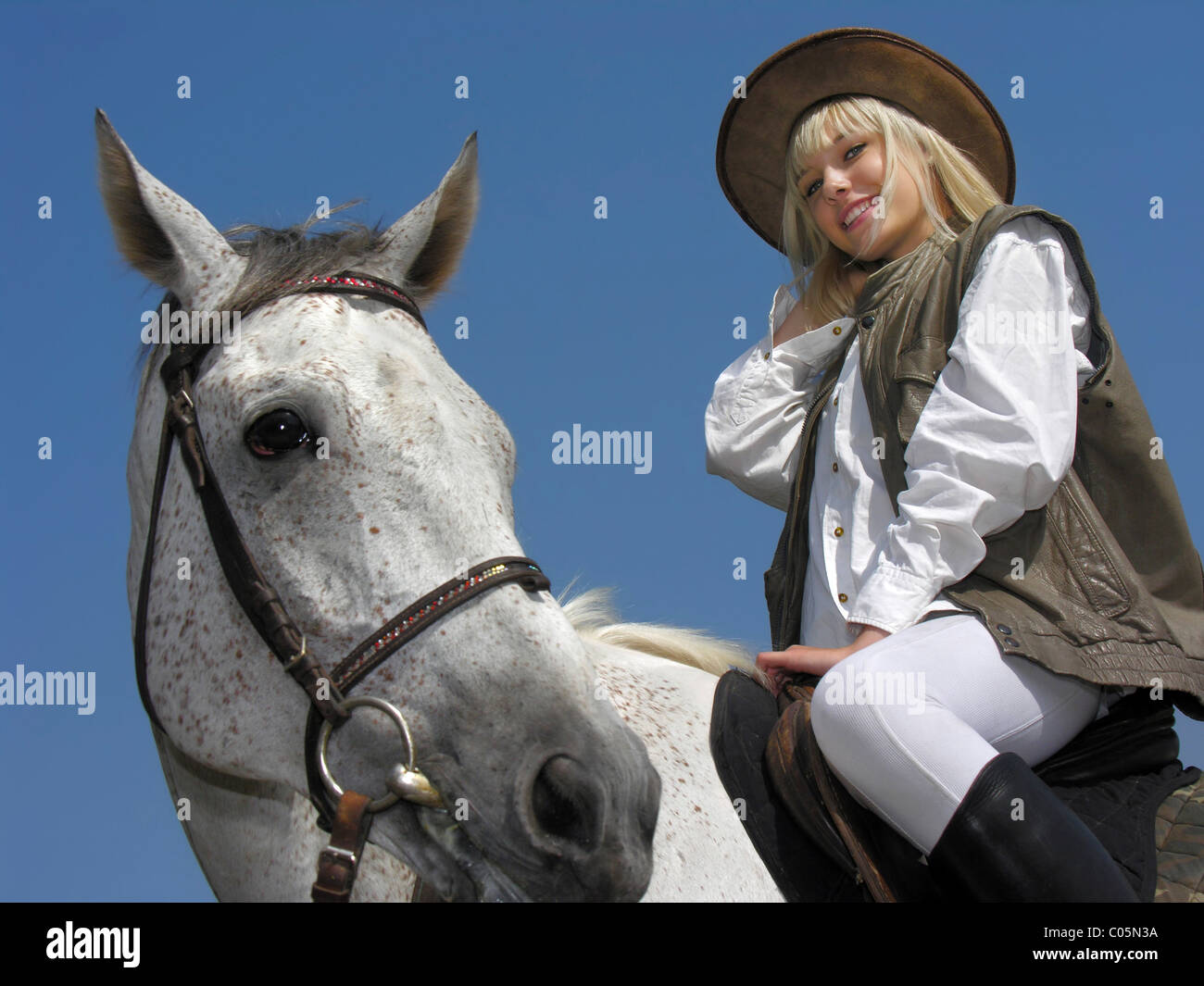 attractive young horsewoman Stock Photo - Alamy