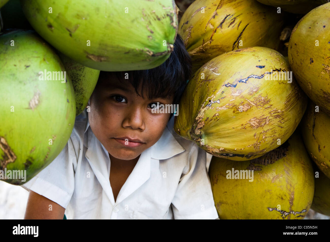 Boy with coconuts hi-res stock photography and images - Alamy
