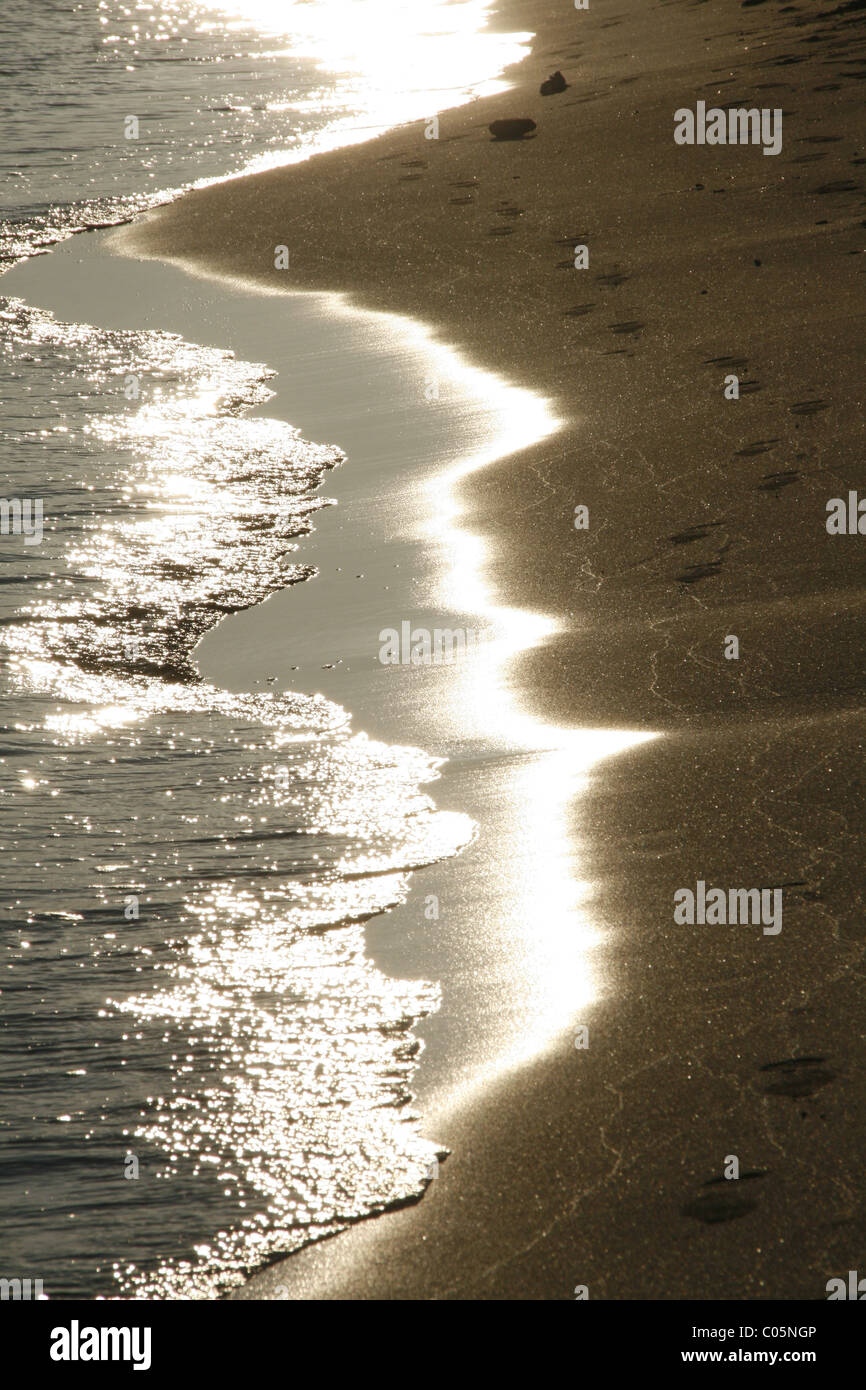 movement of sea waves on sand on beach coast shore Stock Photo - Alamy