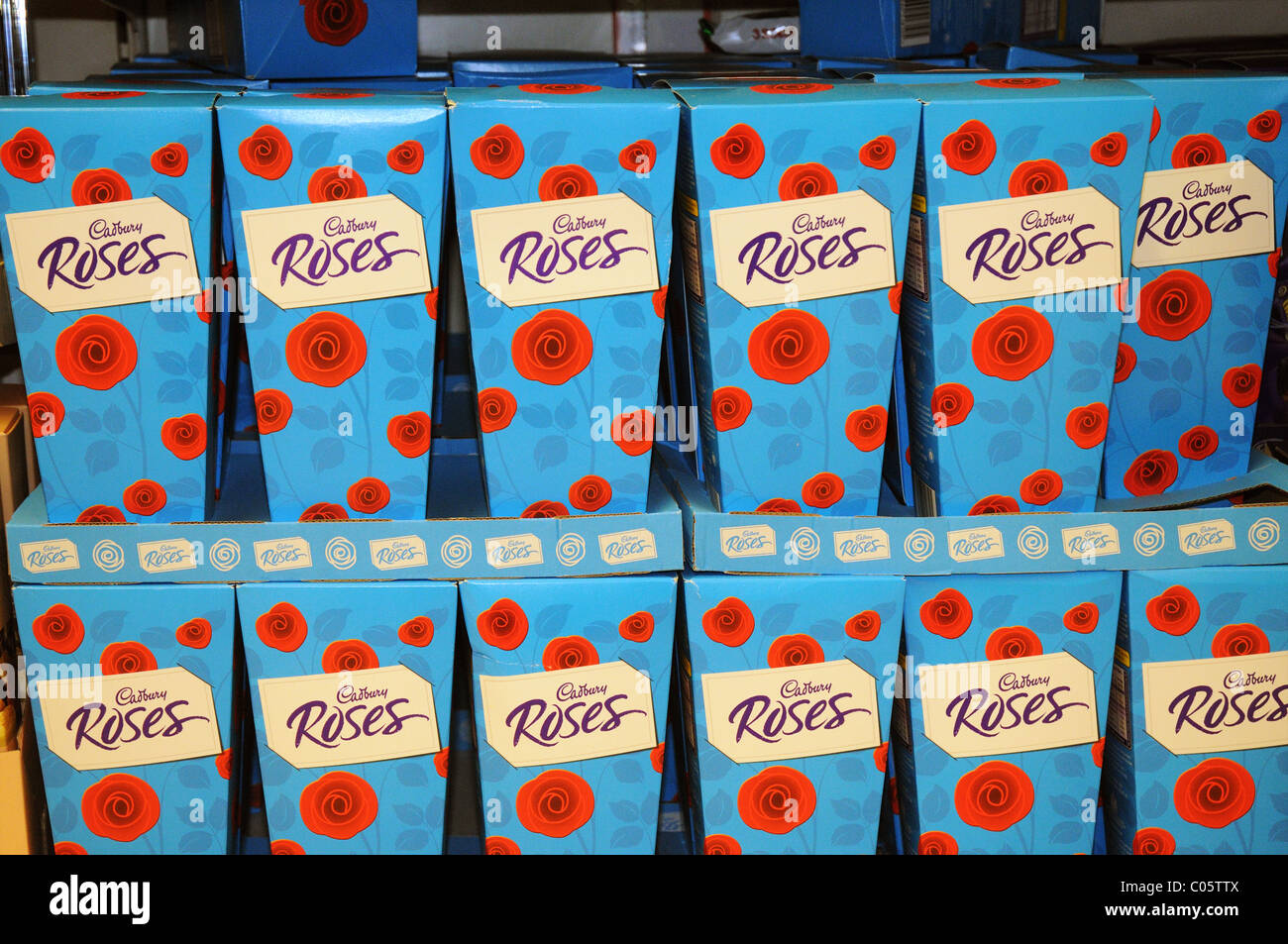 Boxes of Roses chocolates on a shelf in a supermarket in England Stock ...