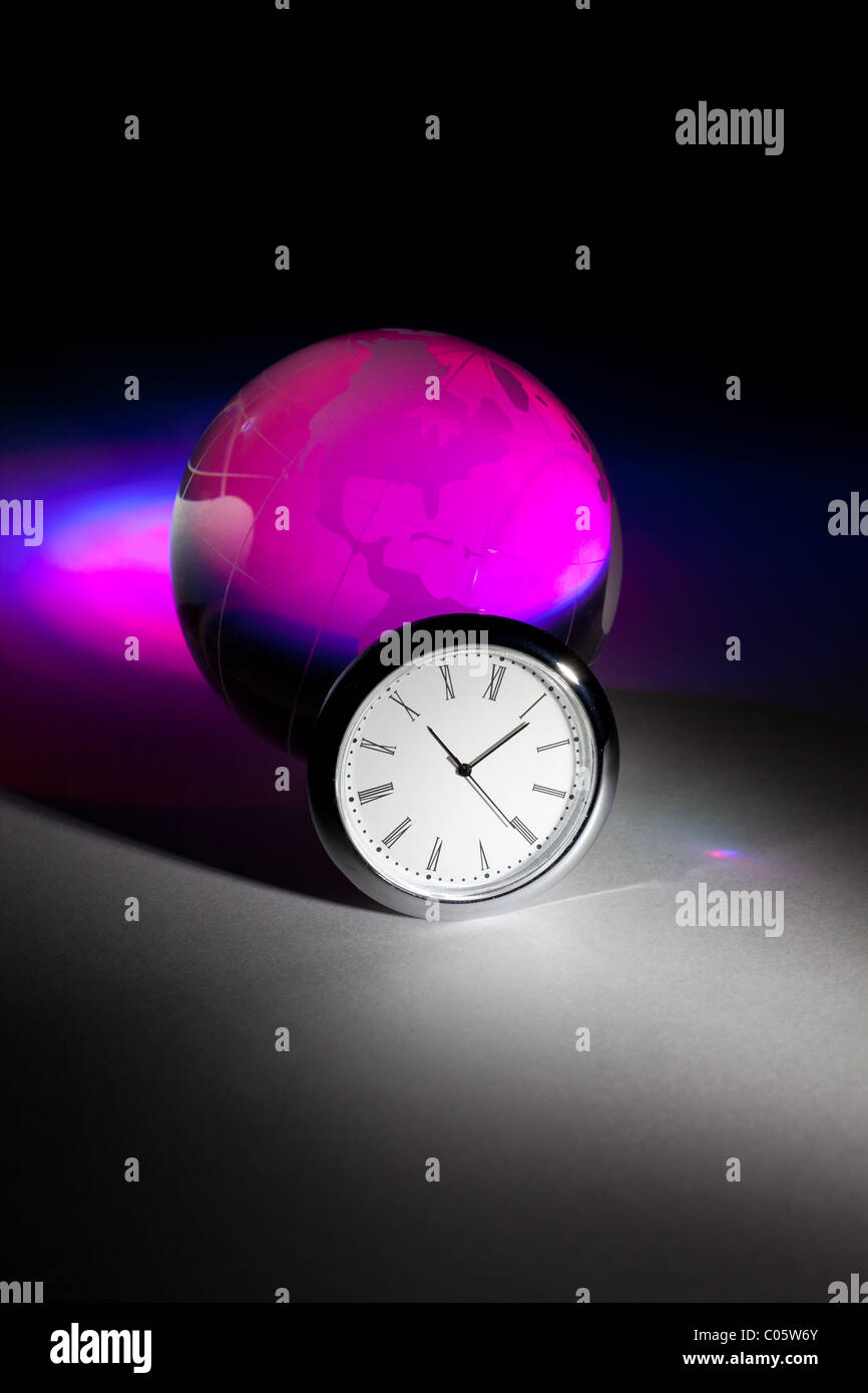Globe and clock for background Stock Photo - Alamy