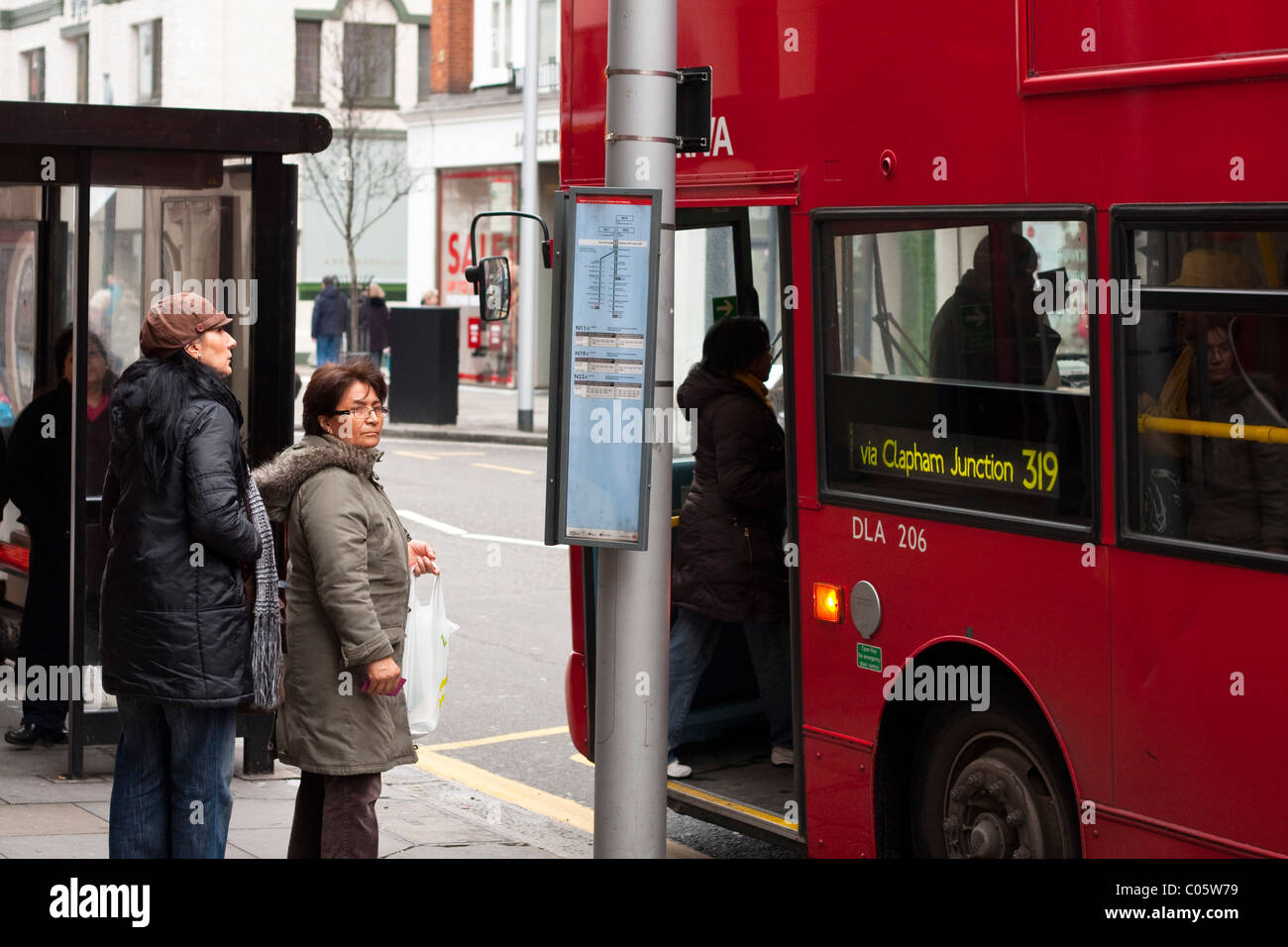 Members of the public about to board a London bus on the Kings Road ...