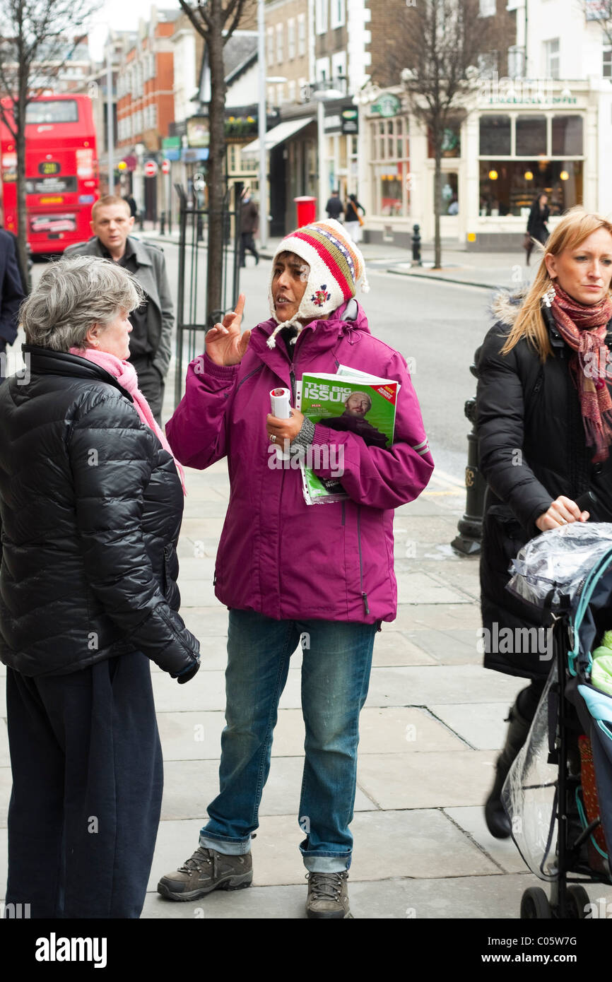 Female Big Issue seller talking to a member of the public, Kings Road ...