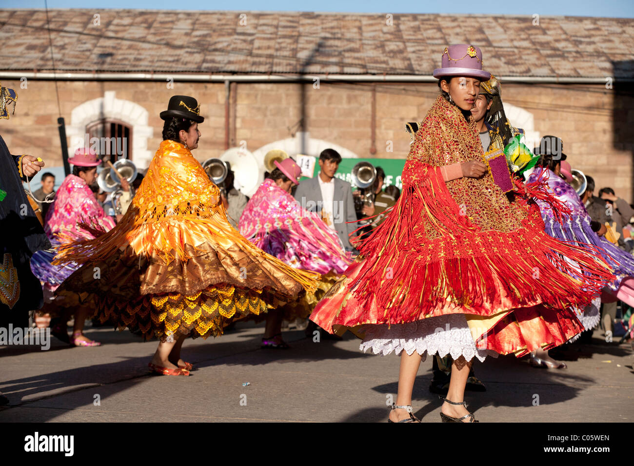 Women dance in traditional costume during the 2010 Puno Week parade ...