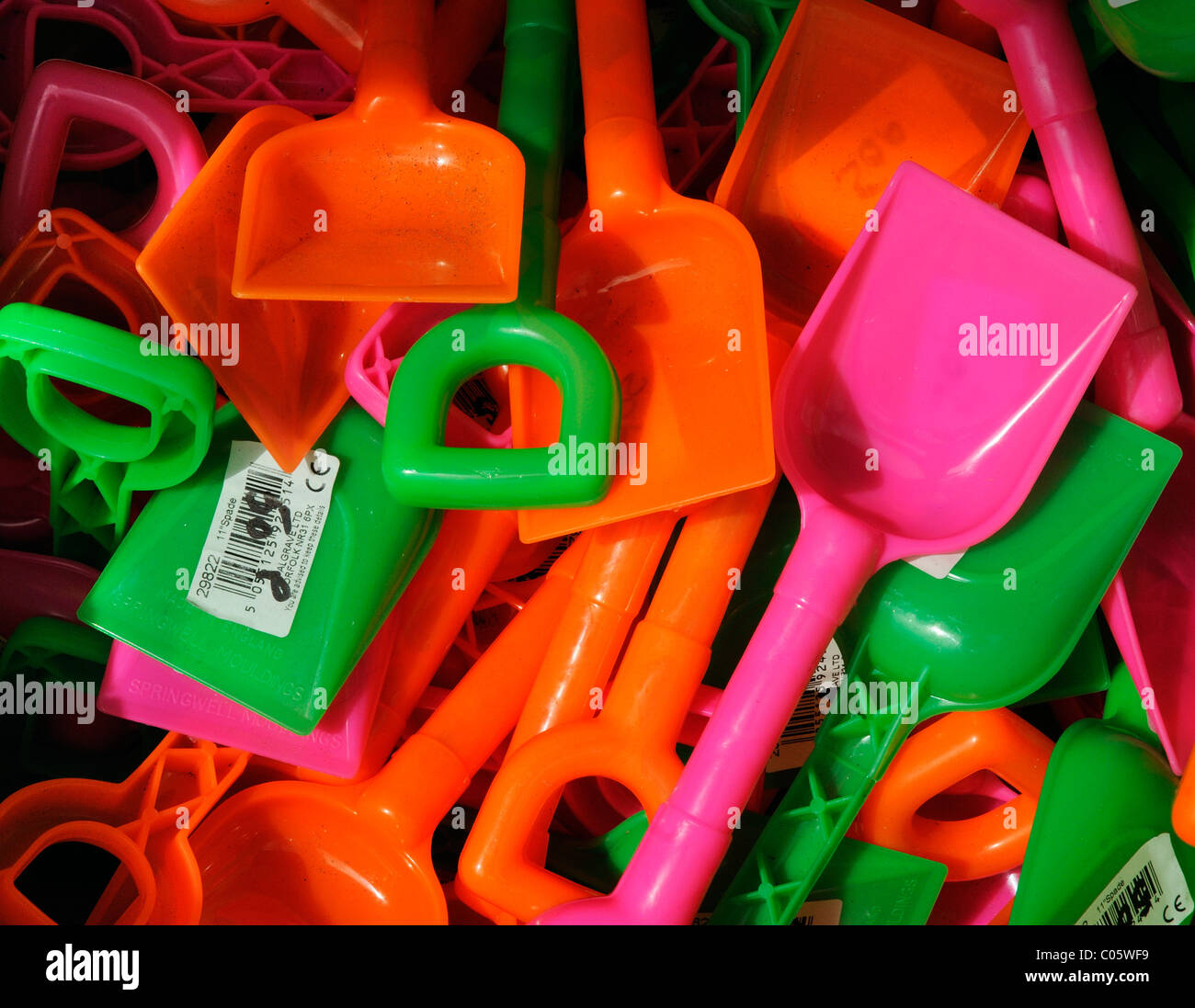 Plastic spades for the beach Stock Photo - Alamy