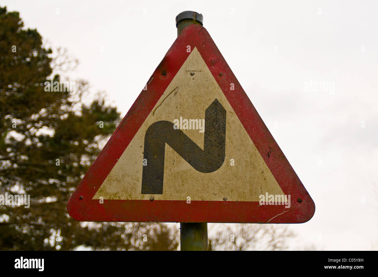 Black and white road bend sign hi-res stock photography and images - Alamy