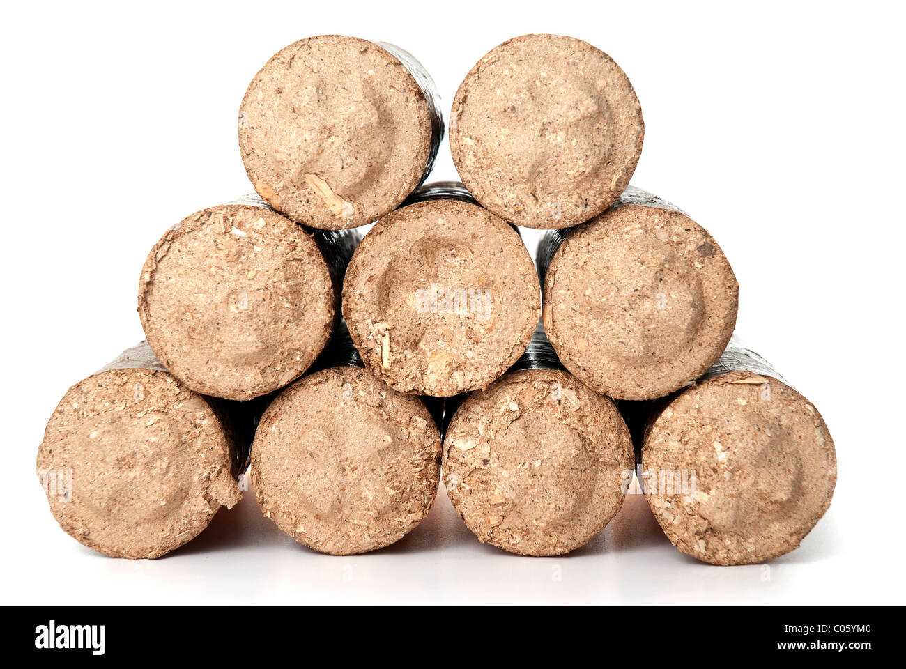 Compacted fireplace wood isolated on white background Stock Photo - Alamy