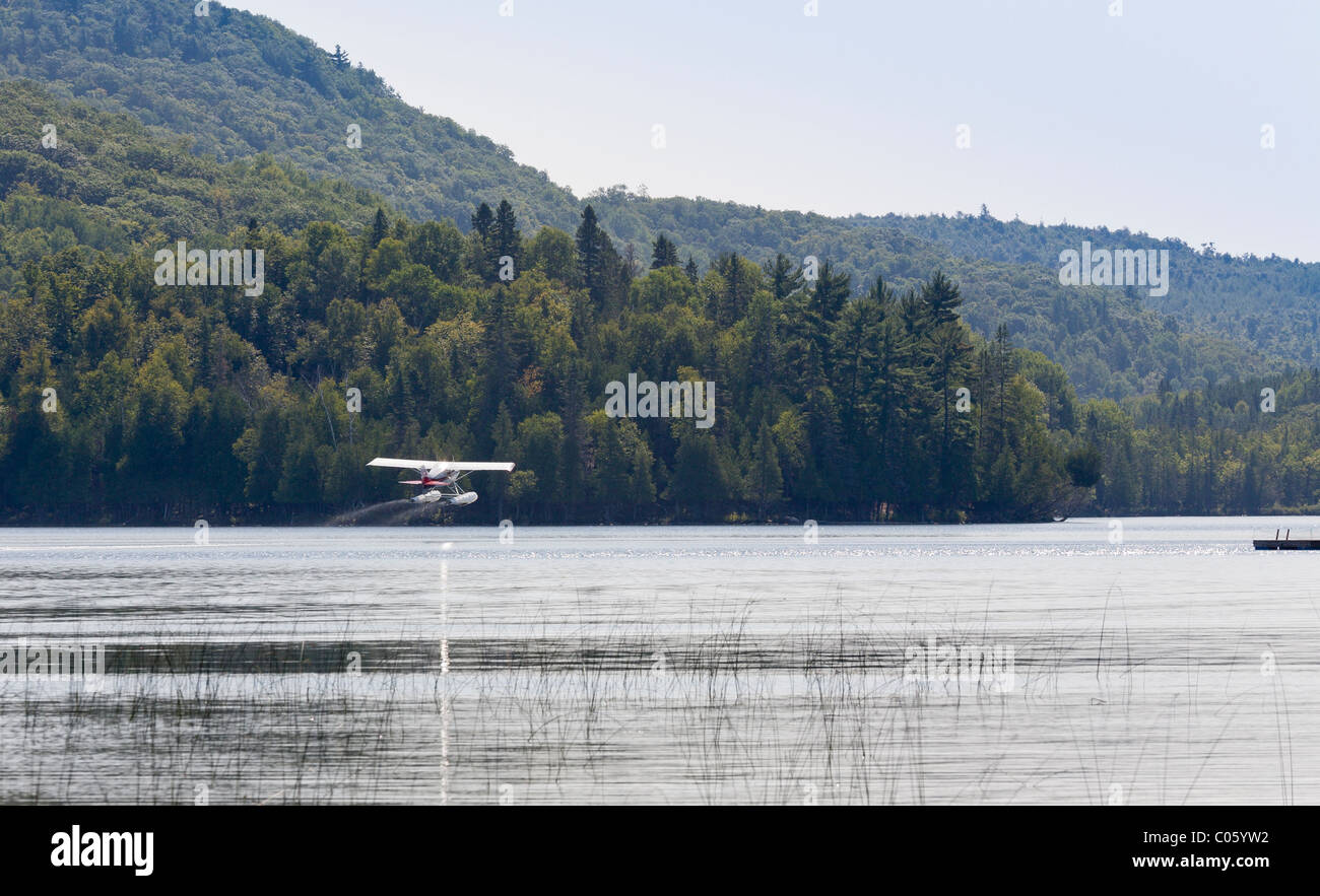 Takeoff: A small single engine float plane gets airborne. A 1974 Maule ...