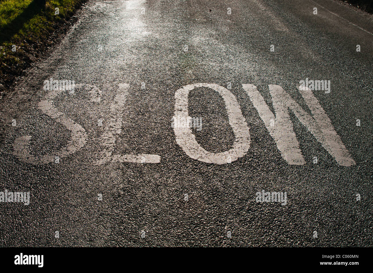 Road marking slow sign painted hi-res stock photography and images - Alamy